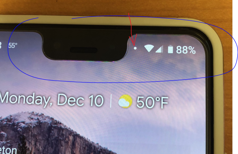 Why is there a small grey circle on my iPad screen?